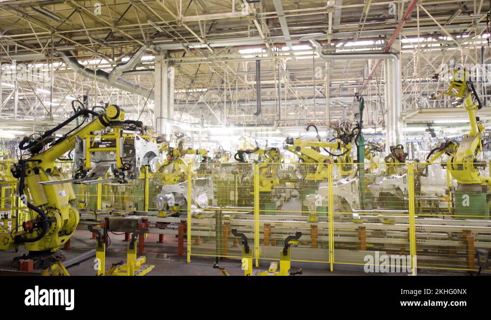 Automated robots at work inside an automobile manufacturing plant Stock ...