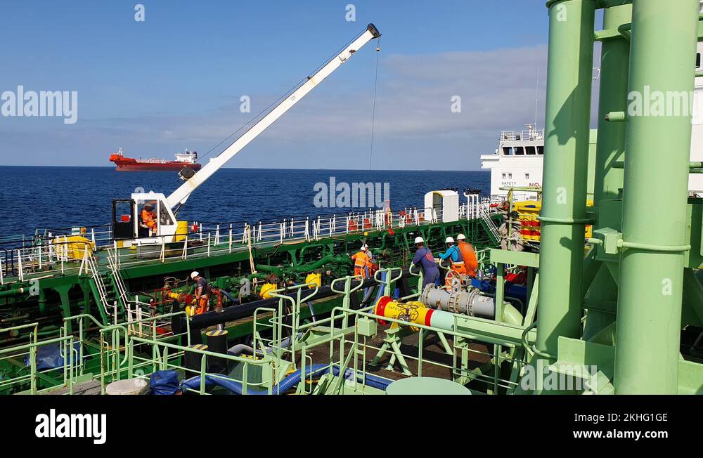tanker hoist helps ship workers to set bunker hoses on deck Stock Video ...