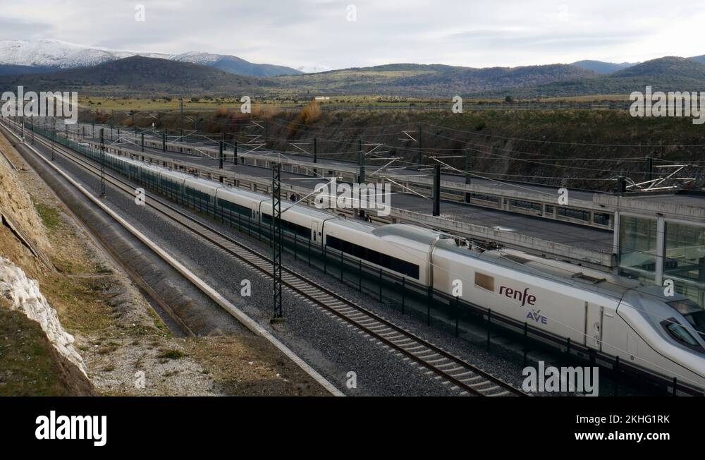 High-speed Ave Renfe train slowly pulling out of Segovia train station ...