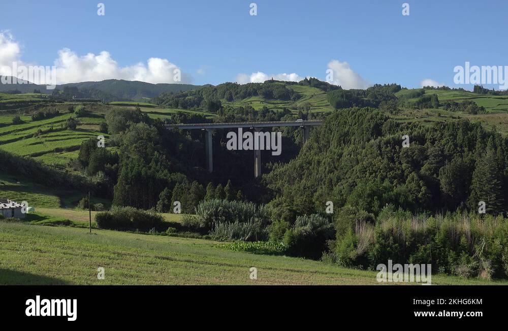 Traffic at the Highway bridge through a gorge in the Sao Miguel Island ...