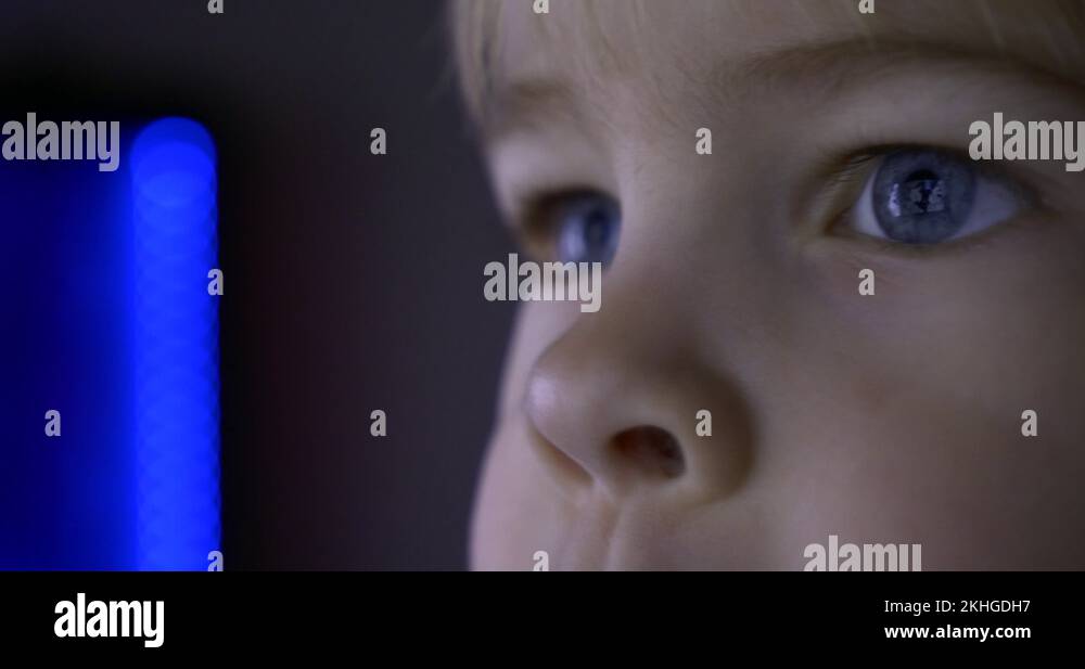 Close-up Child Blue Eyes. Reflection Computer Monitor TV Screen ...