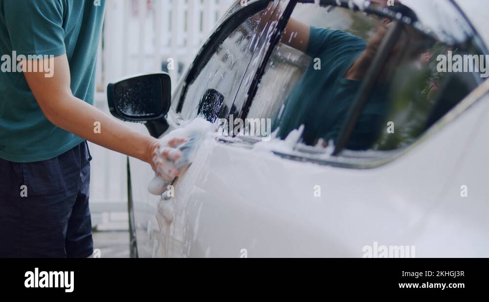 asian man washing his car by using soap and micro fiber wipe at home Stock Video Footage - Alamy