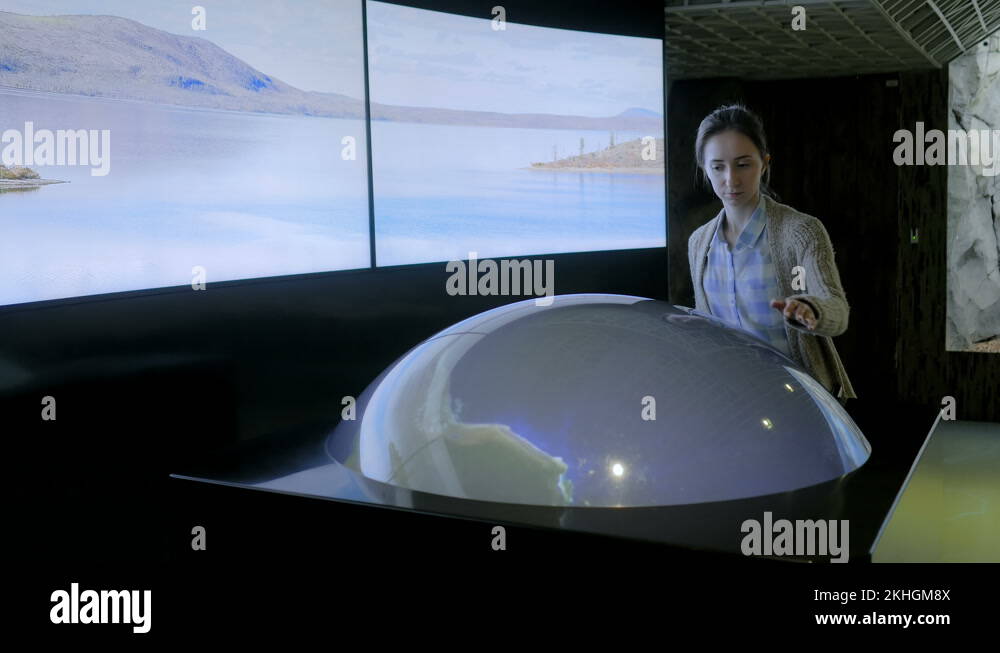 Woman using interactive model of Earth at museum Stock Video Footage ...