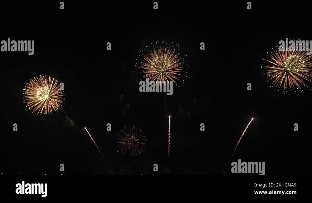 Golden big shiny fireworks with bokeh lights in the night sky Stock ...