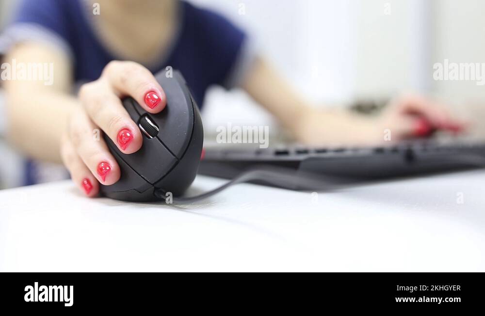 girl's hand uses a vertical ergonomic computer mouse joystick Stock ...