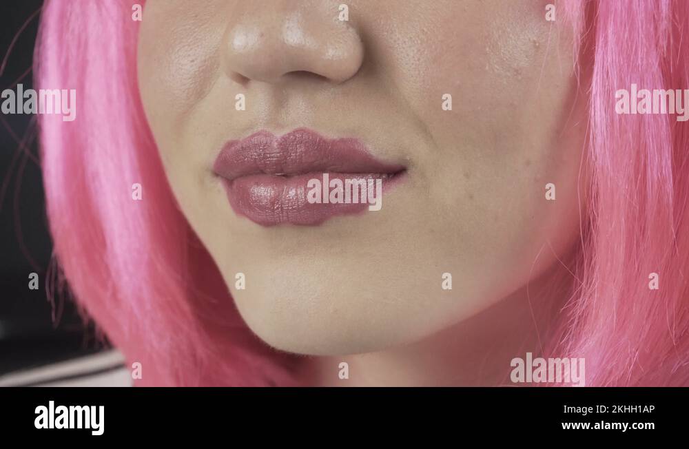 Girl with the lips of the devil. Young beautiful girl with pink hair ...