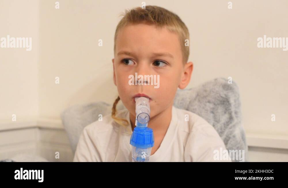 little boy with nebulizer inhaler machine for inhalation Stock Video ...