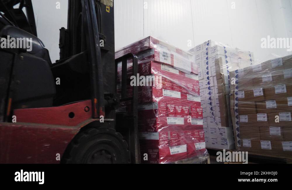employee on forklift truck takes boxes stack in warehouse Stock Video ...
