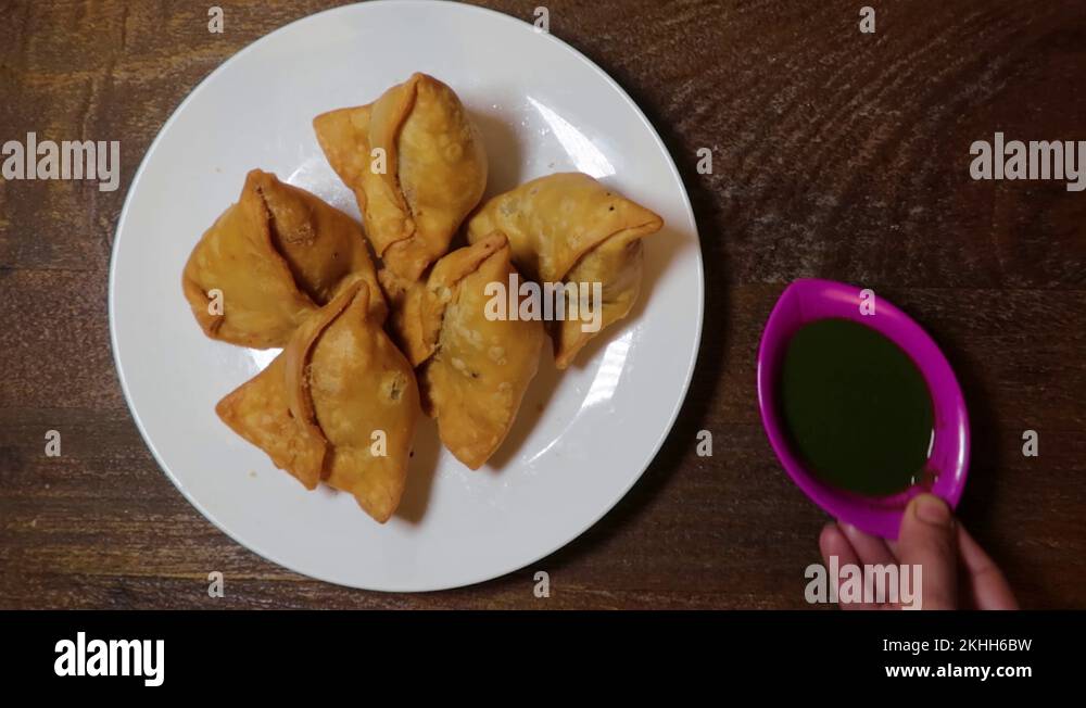 Most popular Indian punjabi snacks SAMOSA with sauces, high angle shot ...