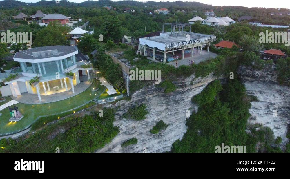 Drone footage of a big building with modern architecture on the cliff ...