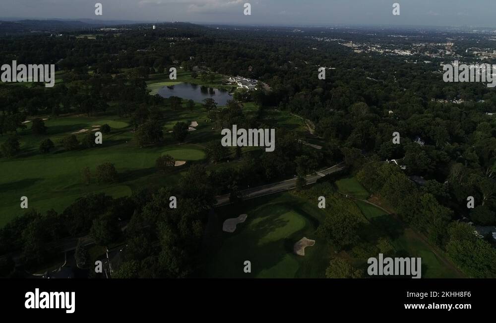 Iconic 4K aerial of a typical American suburban golf course in summer ...