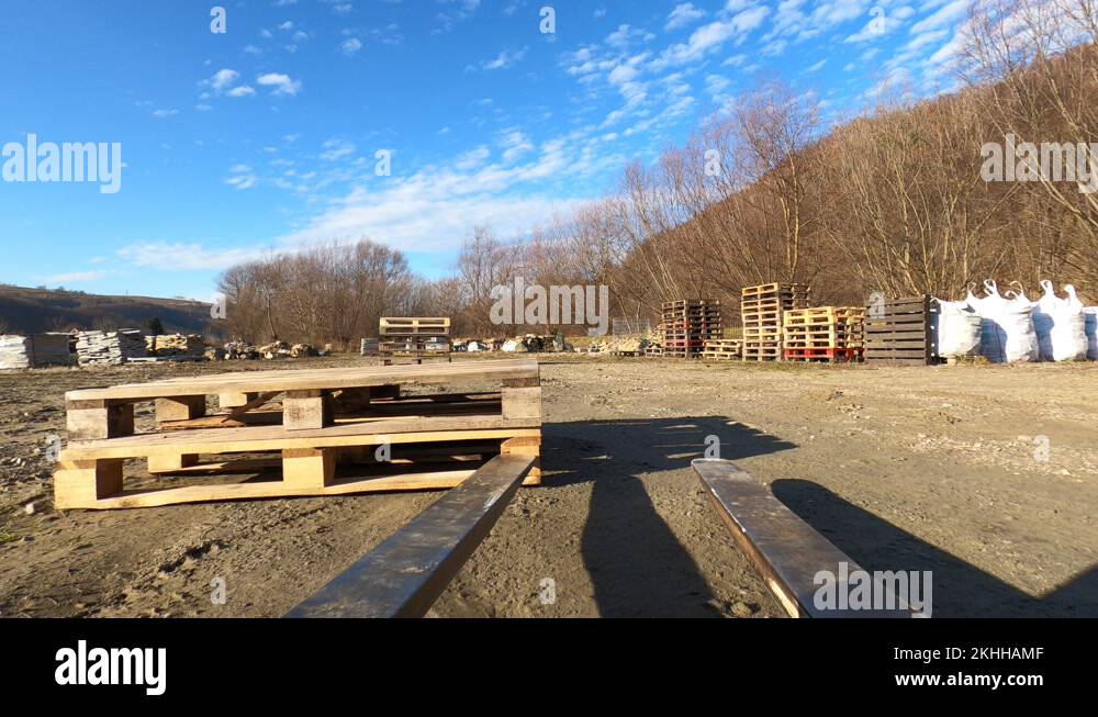 Forklift moving corner of pallet by forks Stock Video Footage - Alamy