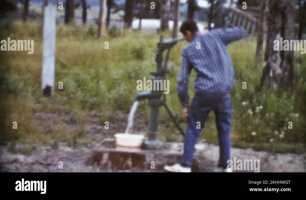 Man Pumps Water At A Well During Camping Trip-1967 Vintage 8mm film ...