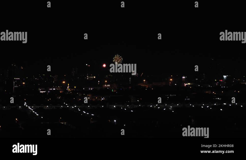 4k. Golden big shiny fireworks with bokeh lights in the night sky Stock ...