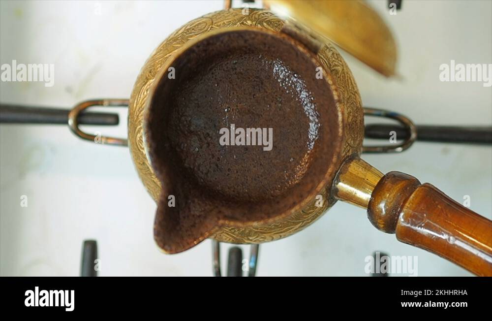 Traditional turkish coffee pot on gas cooker with hot coffee Stock ...