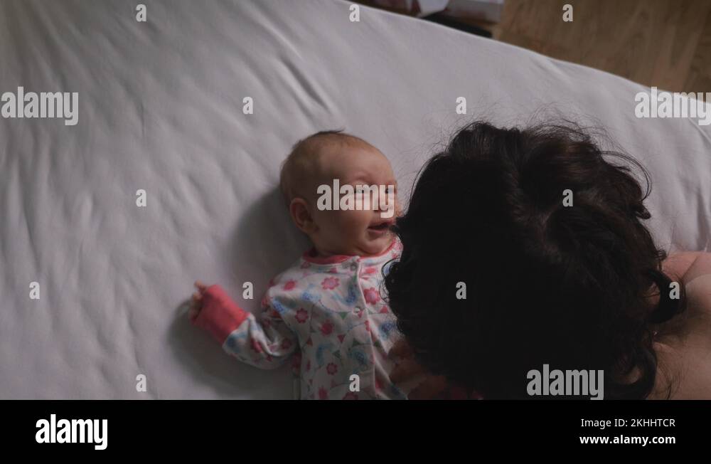 Mom Tickling Newborn Baby Stock Video Footage - Alamy