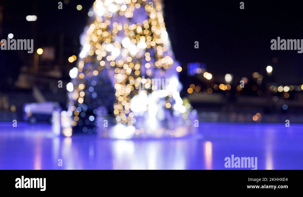Blurred Christmas tree in bokeh effect with Garland lights blinking on ...