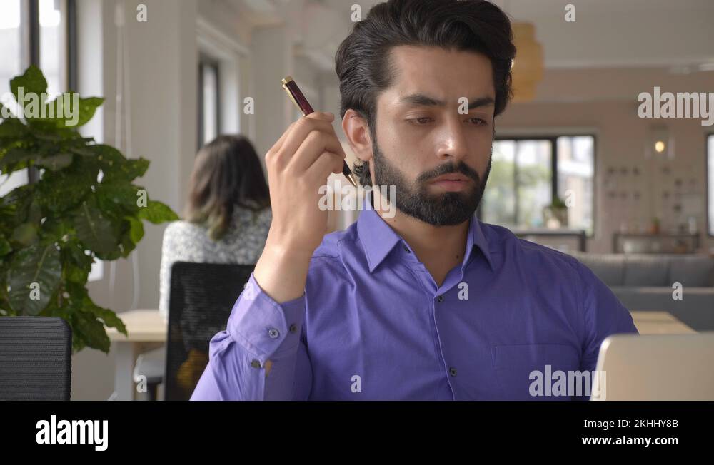 P1077780 An Indian male employee working in the office Stock Video ...