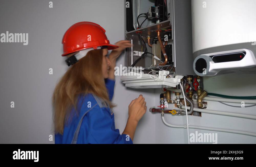 Technician servicing hot water heater Stock Videos & Footage - HD and ...