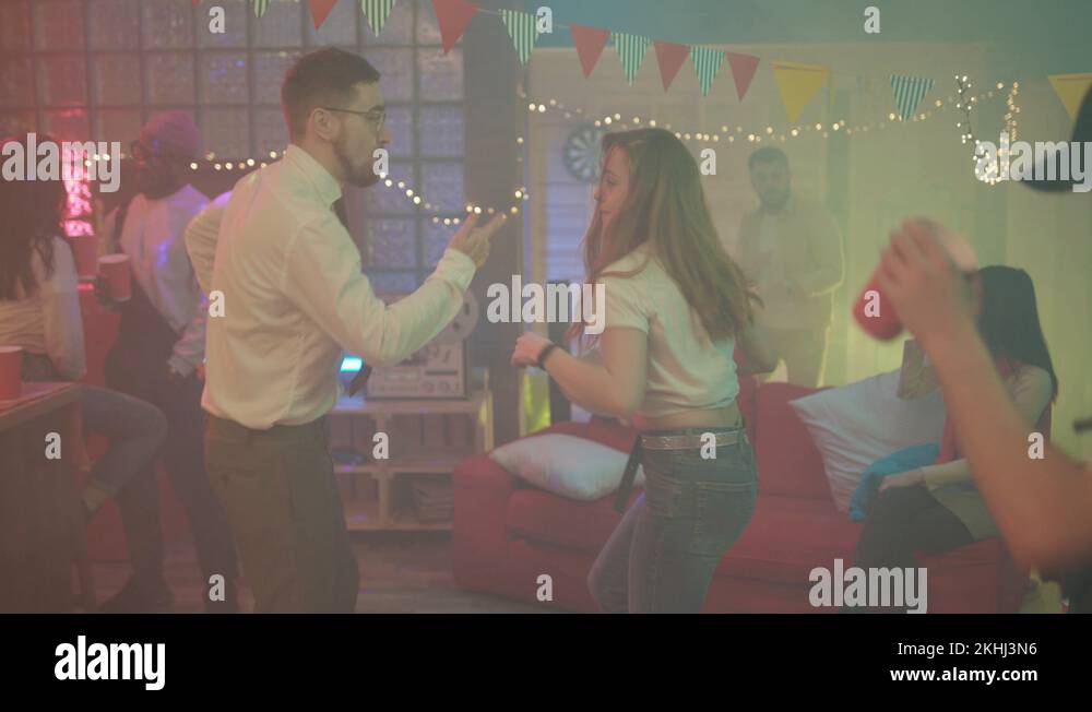 Dance party. Euphoric joyful young men and woman dancing together on ...