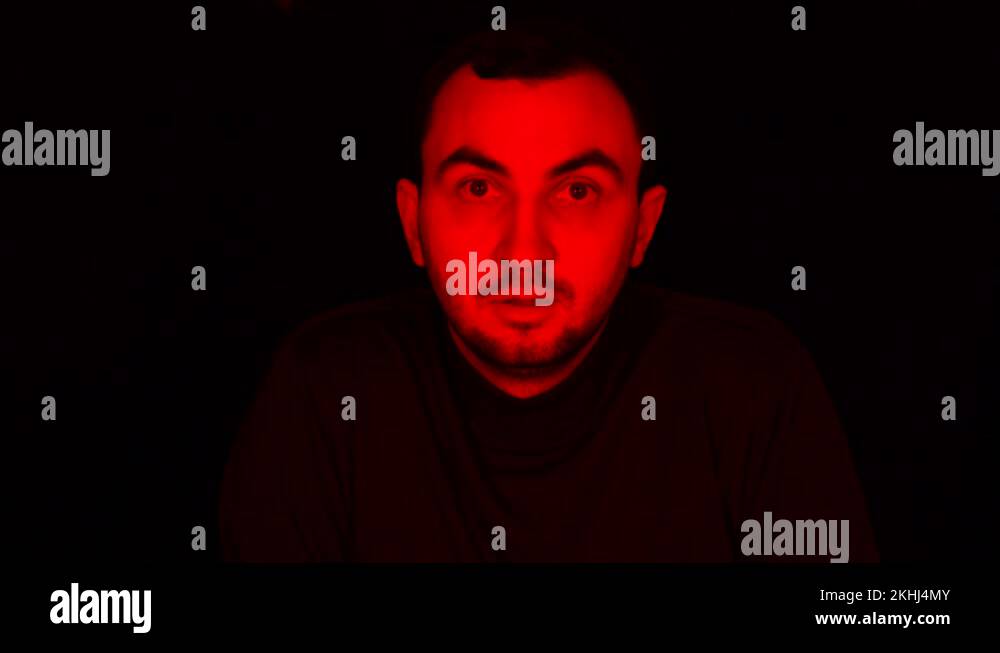 Man Face in Dark, with Red Glowing Light, Facial Expressions. Portrait ...