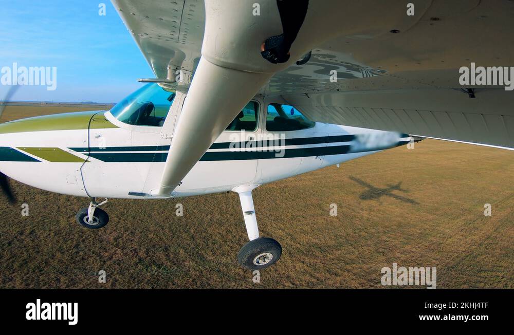 Landing of a small jet filmed from a side view Stock Video Footage - Alamy