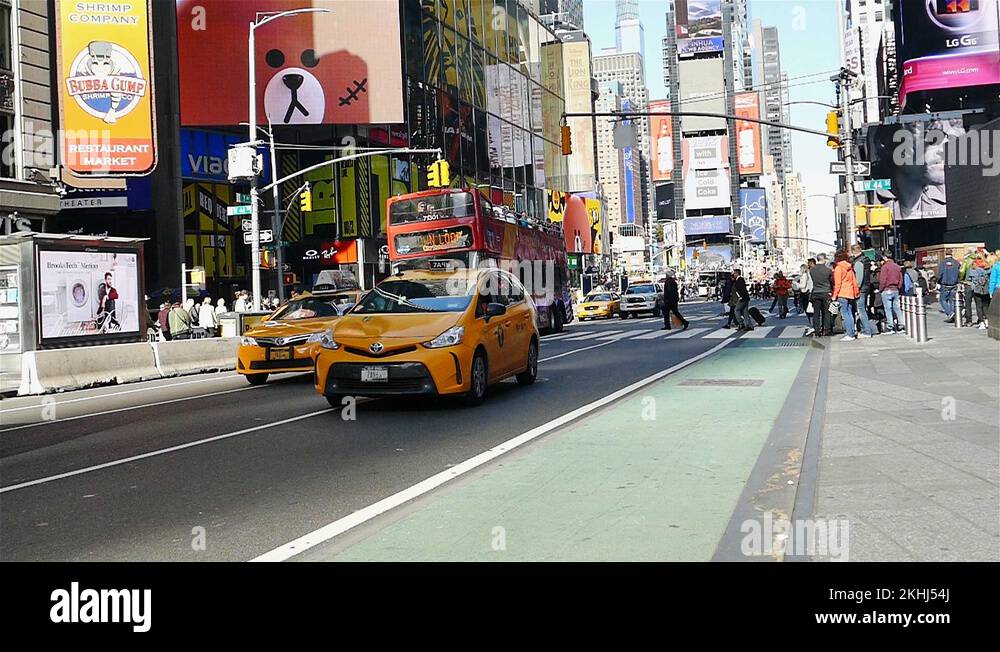 Busy Times Square with cars, and pedestrians in slow motion Stock Video ...
