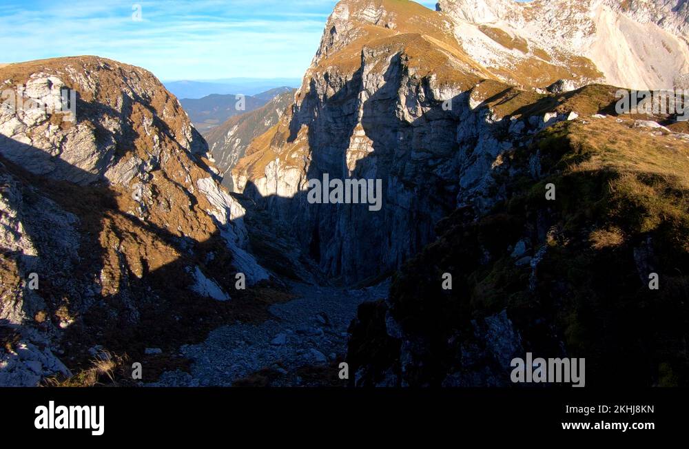 Tilt up Alps mountain edge and peaks with view of valley Stock Video ...