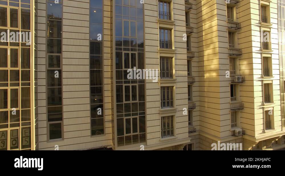 A vertical inspection of a modern building with a beautiful sunny ...