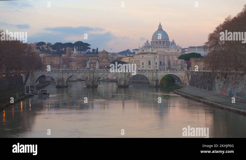 St Peter's Basilica at sunrise reflecting on the Tevere river, Rome ...