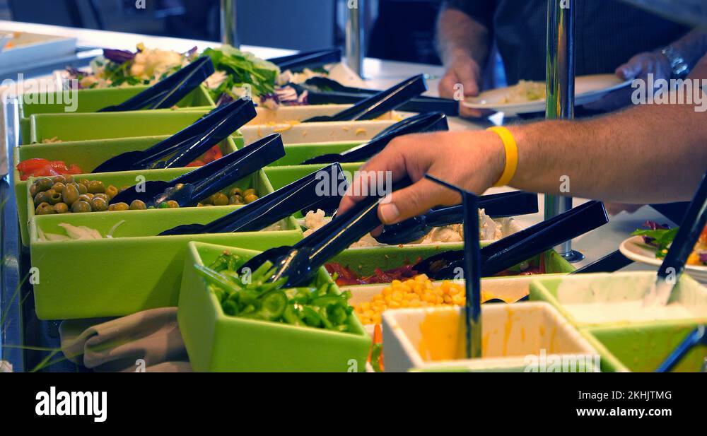 People taking food at cuisine culinary catering all-you-can-eat buffet ...
