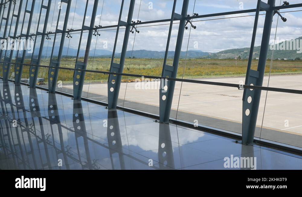 Modern airport, beautiful view of runway and passenger terminal through ...