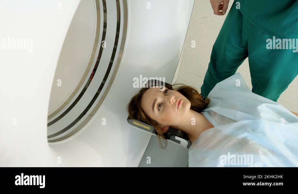 Female patient is undergoing MRI or CT scan under supervision of radiologist. 4K Stock Video ...