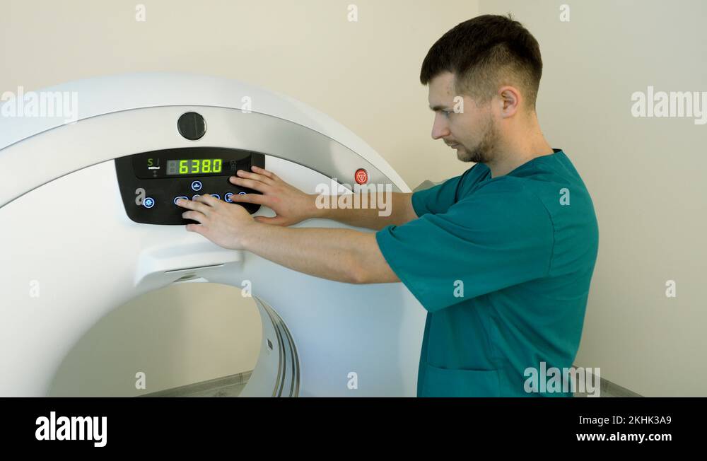 Aged patient is undergoing MRI or CT scan under supervision of a ...