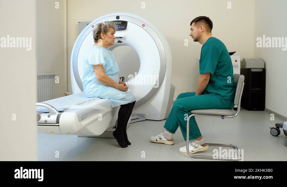 Doctor talking to elderly female patient. MRI or CT scan in modern hospital. 4K Stock Video ...