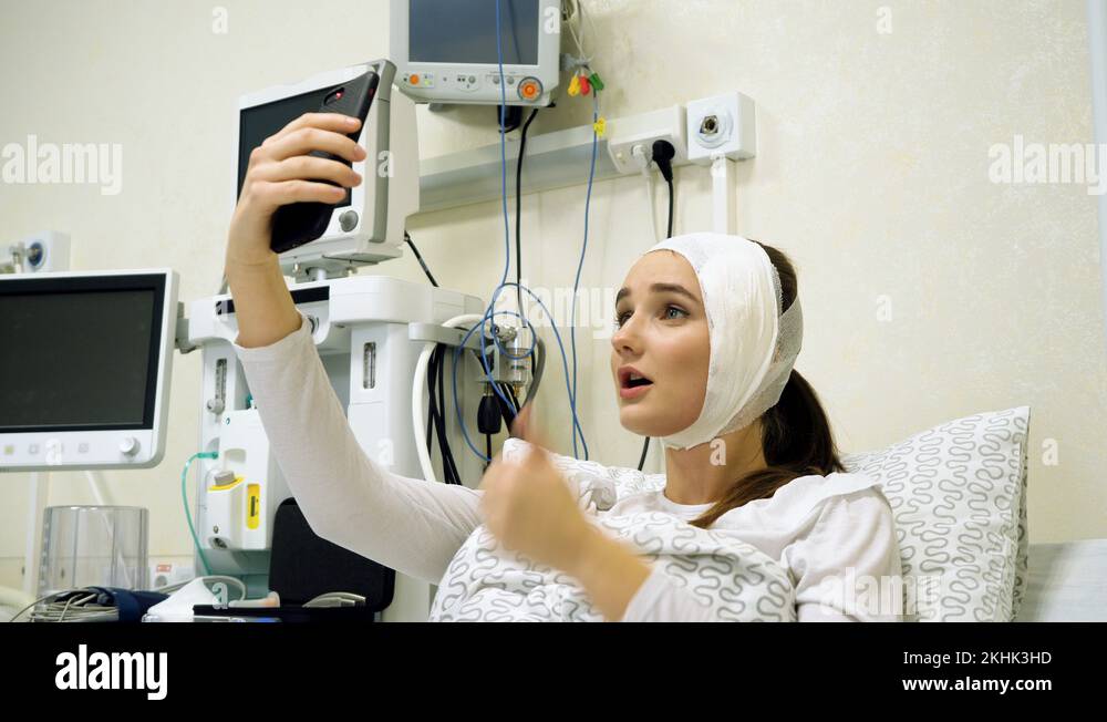 Cute girl vlogger recording vlog at modern hospital. Social media ...