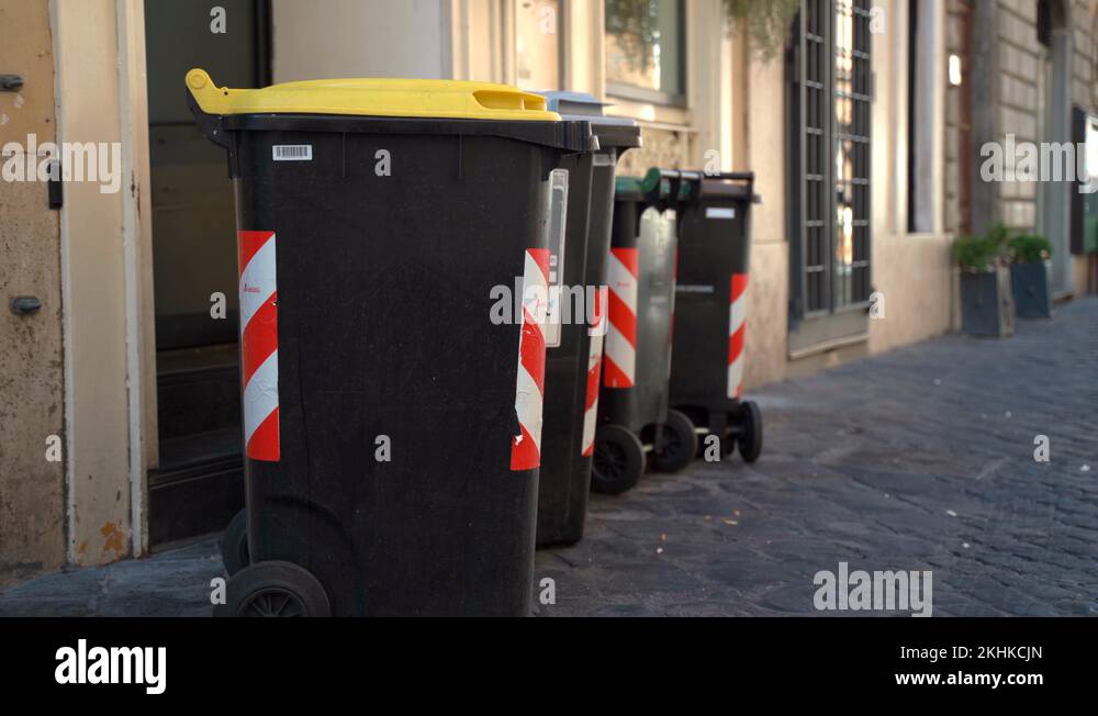 Plastic trash containers on the street in Rome. Garbage containers for ...