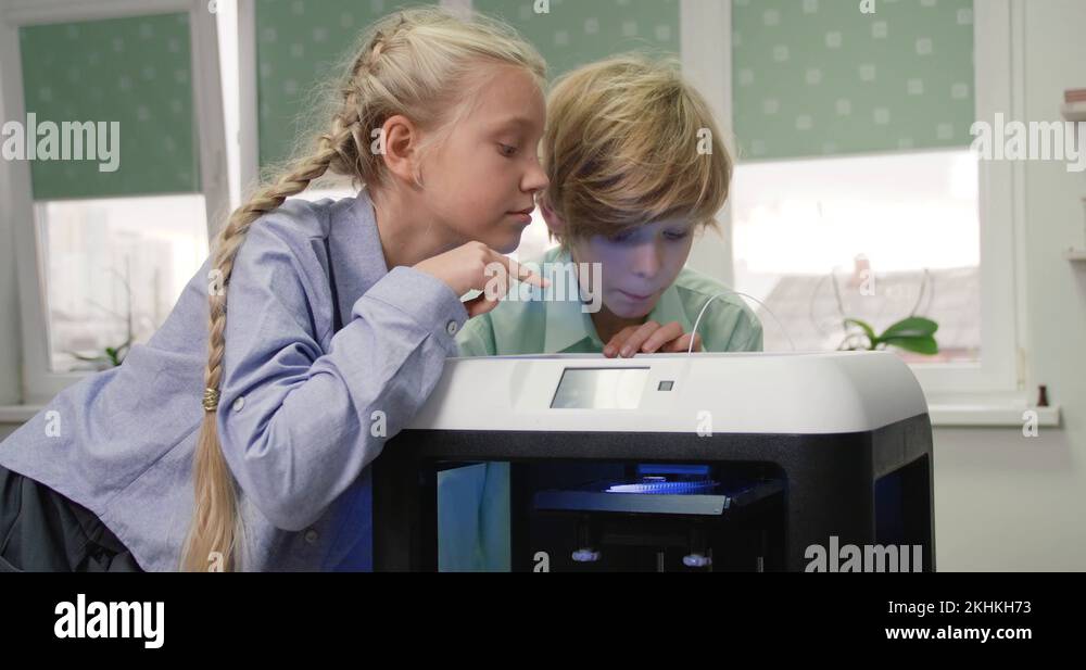 Education in the modern school, children learn modeling, boy and girl ...