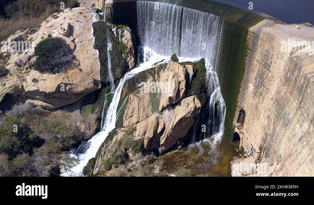 The aerial view of the huge water dam in Cascada Pantano Elche in Spain ...