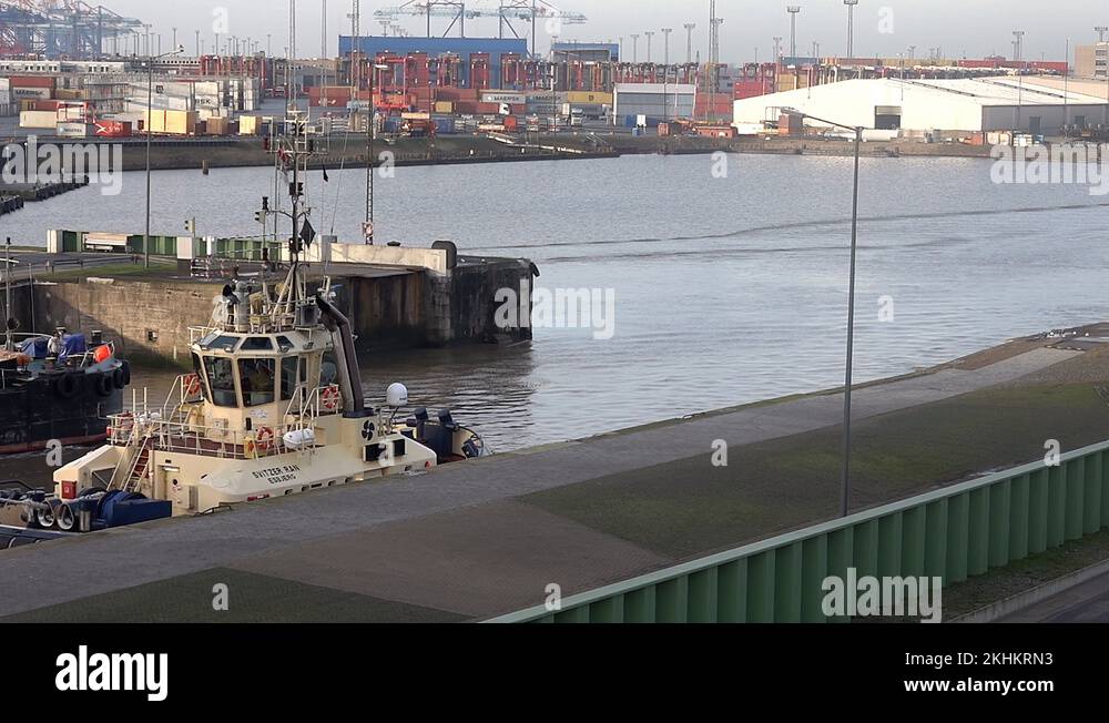 Passage of an empty freighter for general cargo through the port gate ...
