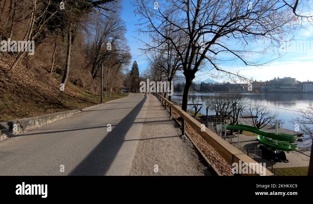 Forward moving walking on lake Bled promenade road for pedestrian only ...