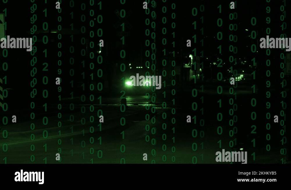 Truck crossing tracks as a train approaches with binary computer code ...