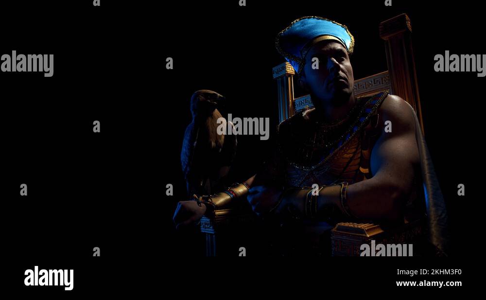 Pharaoh wearing traditional egyptian clothes is sitting on his throne ...