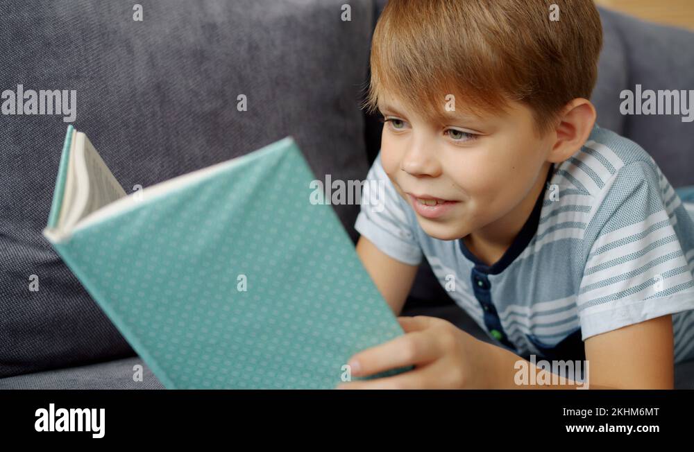Child reading alone Stock Videos & Footage - HD and 4K Video Clips - Alamy