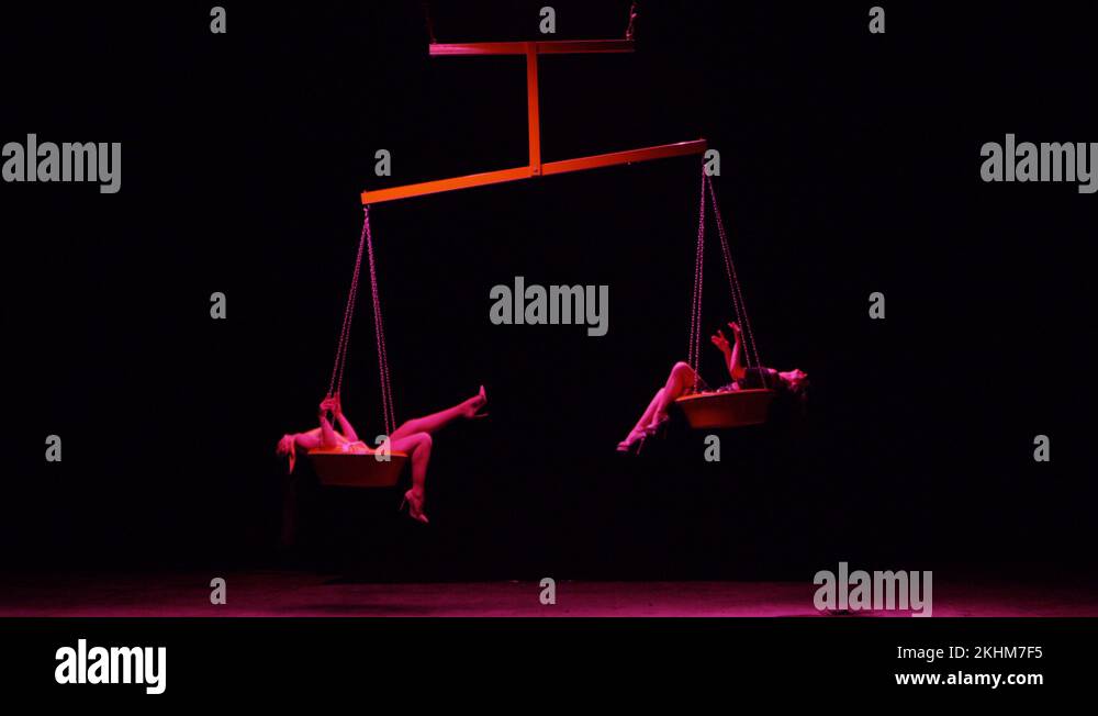 Footage of two female models dancing inside jewelry retro weigher or ...