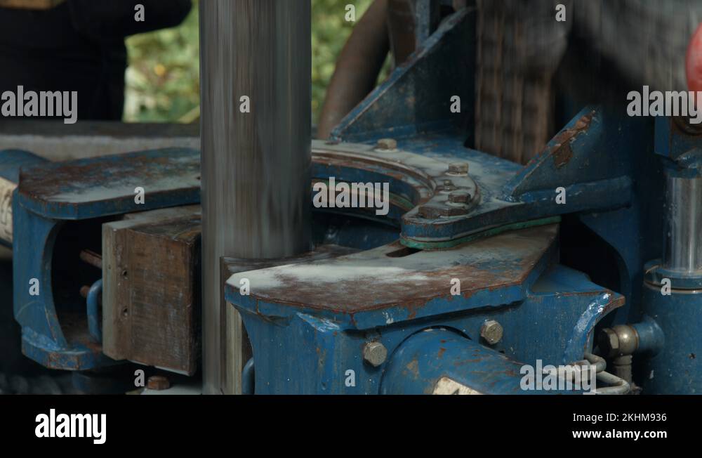 Drilling rig pulling out drill pipe after boring a geothermal borehole ...