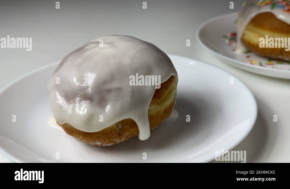 Sprinkle pastry topping on the glazed bakery Stock Video Footage - Alamy