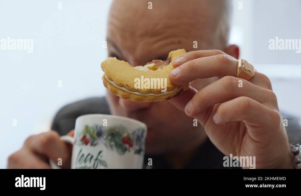 Man eating biscuit Stock Videos & Footage - HD and 4K Video Clips - Alamy