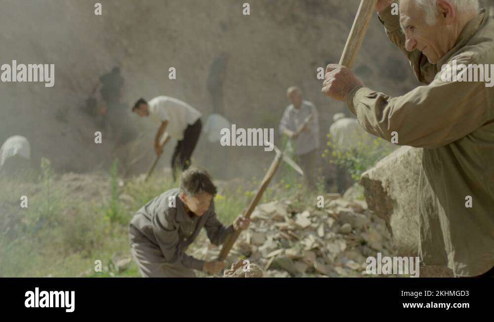 A group of miners or gold diggers working . Many workers mining in a ...