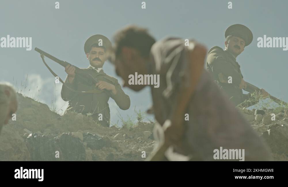 Two security soldiers controlling how to work miners in a quarry Stock ...